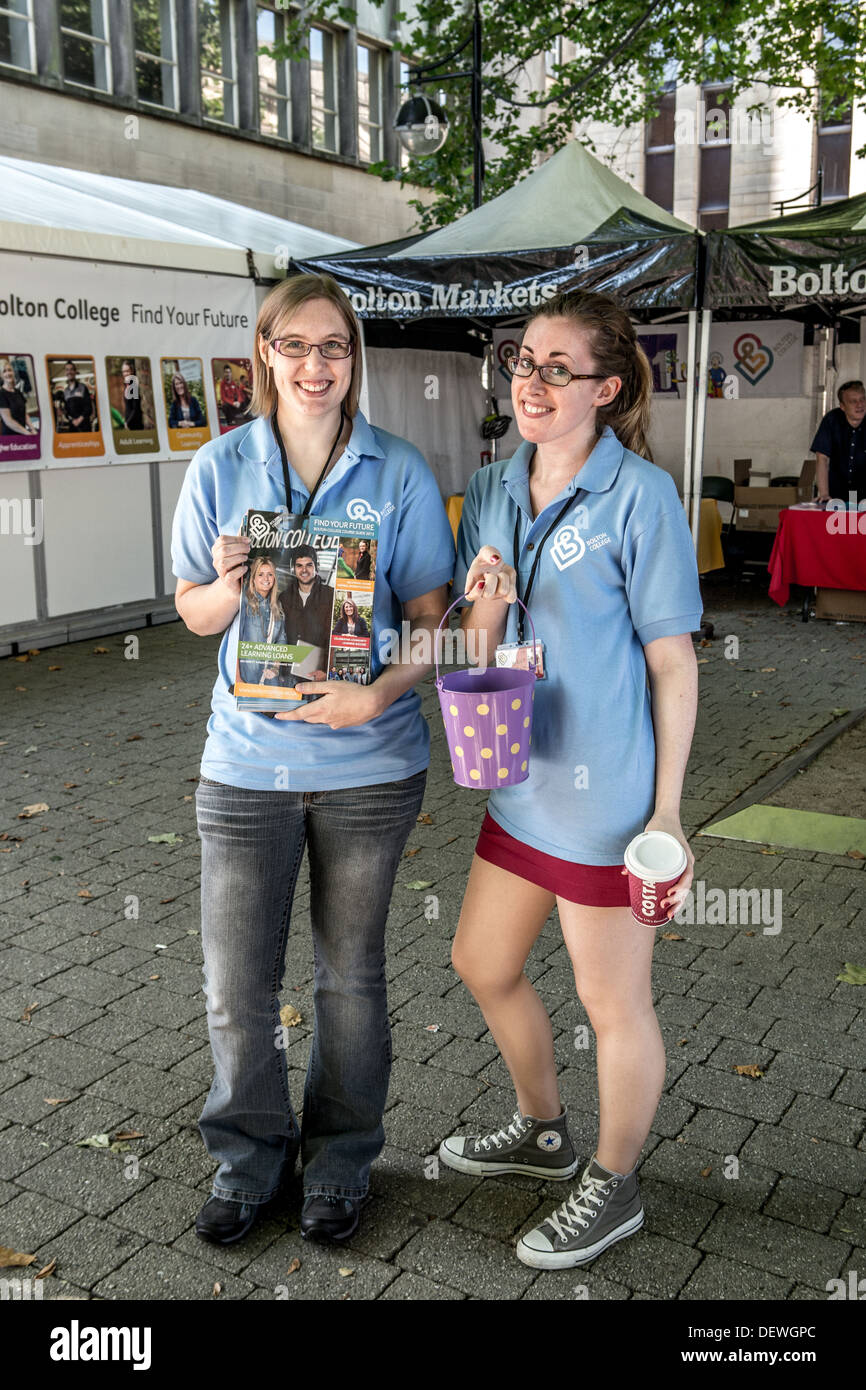 Two girls advertising Bolton College Stock Photo - Alamy