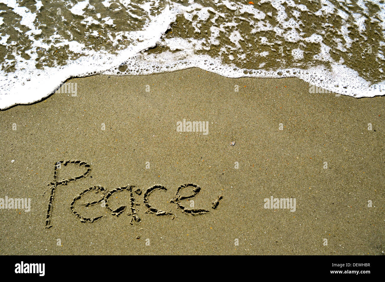 Peace written in the sand Stock Photo - Alamy