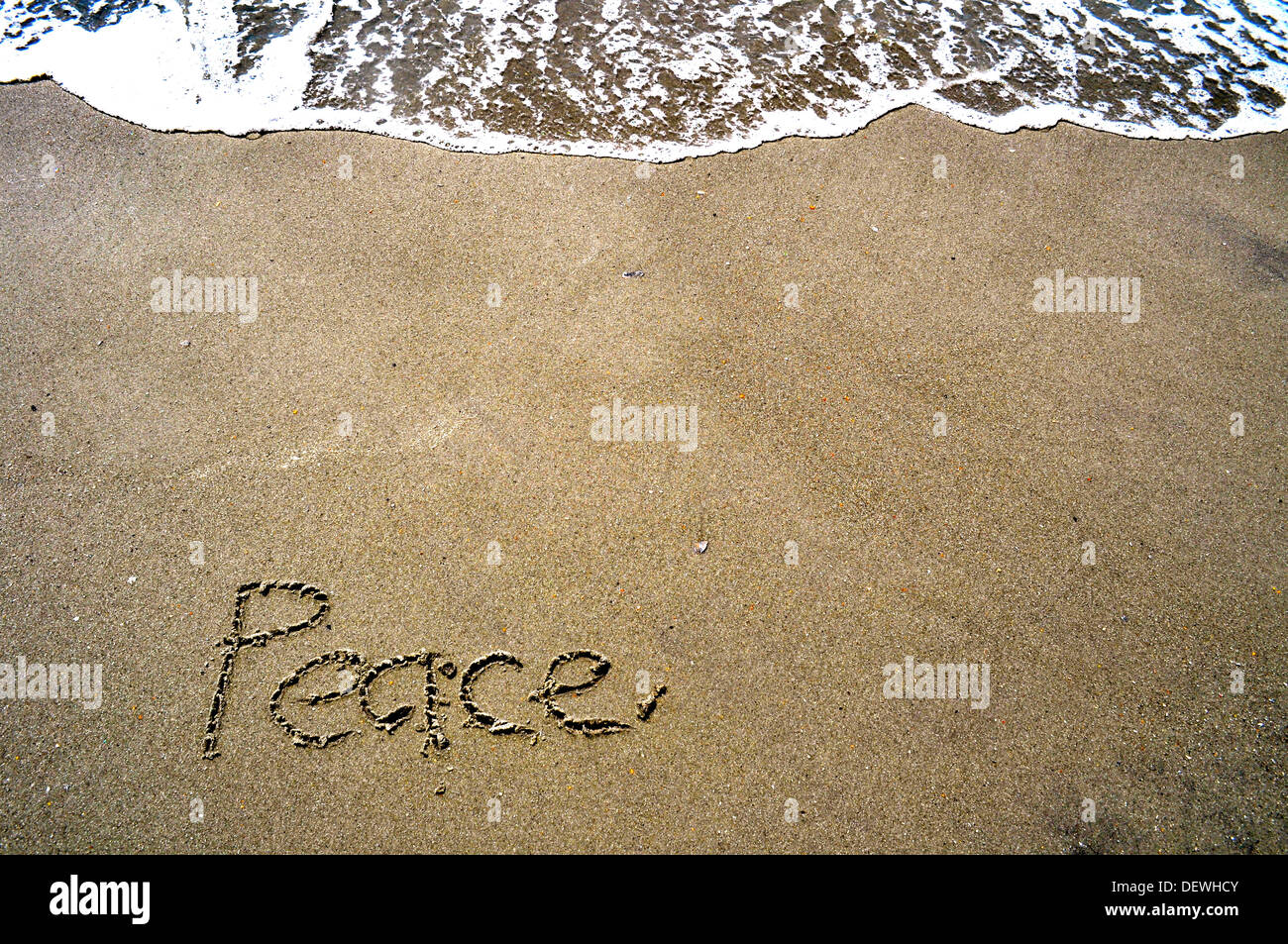 Peace written in the sand Stock Photo - Alamy