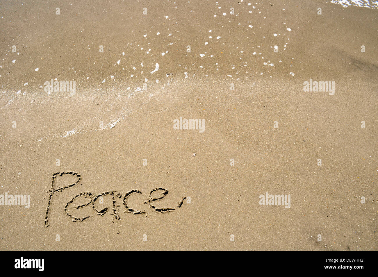 Peace written in the sand Stock Photo - Alamy