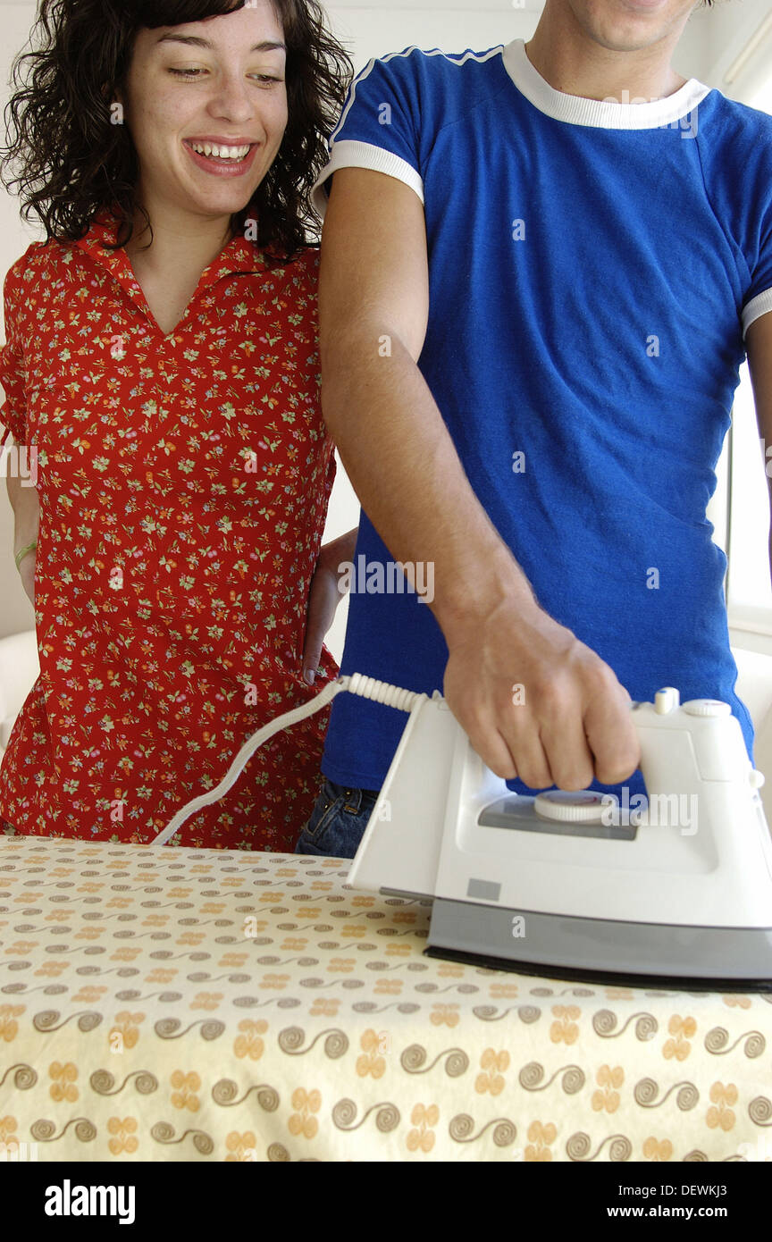 Boy ironing doing housework Stock Photo - Alamy