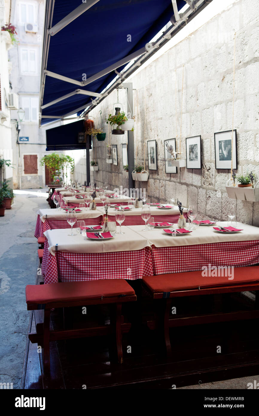 Busola restaurant with tables outdoor and under a vaulted passage in ...