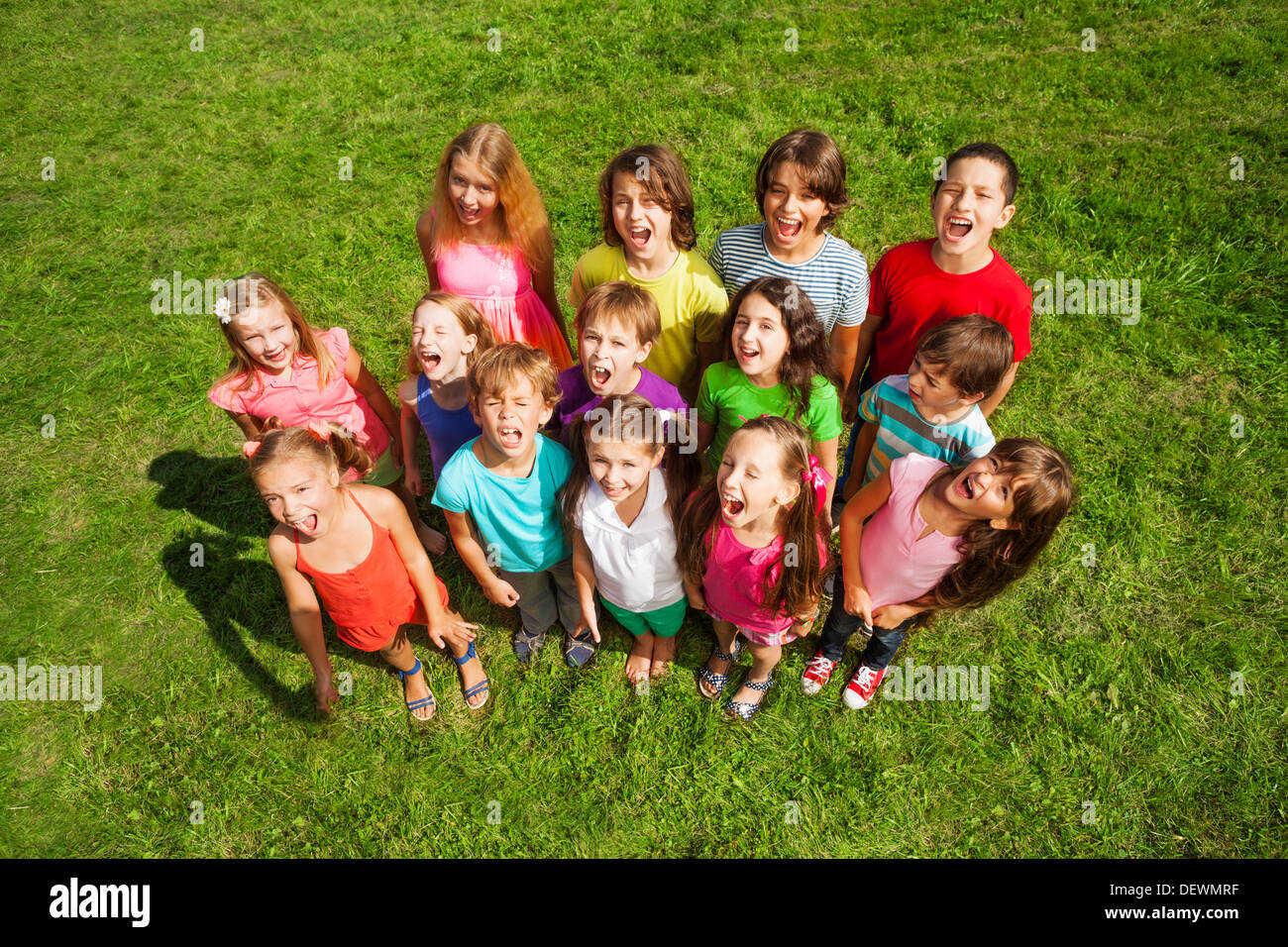 Large group of happy kids, boys and girls, about 10 years old standing ...