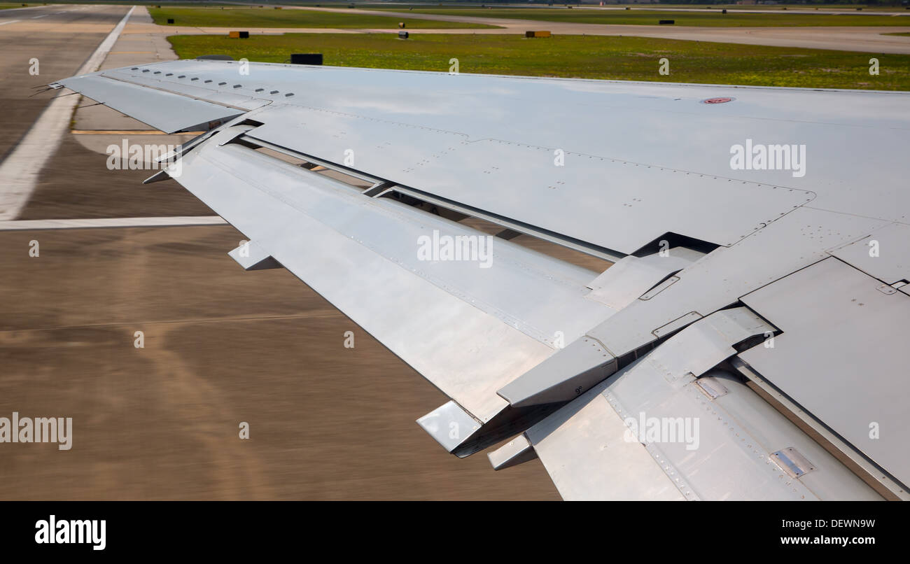 aircraft plane wing taking off on airport getting speed Stock Photo - Alamy