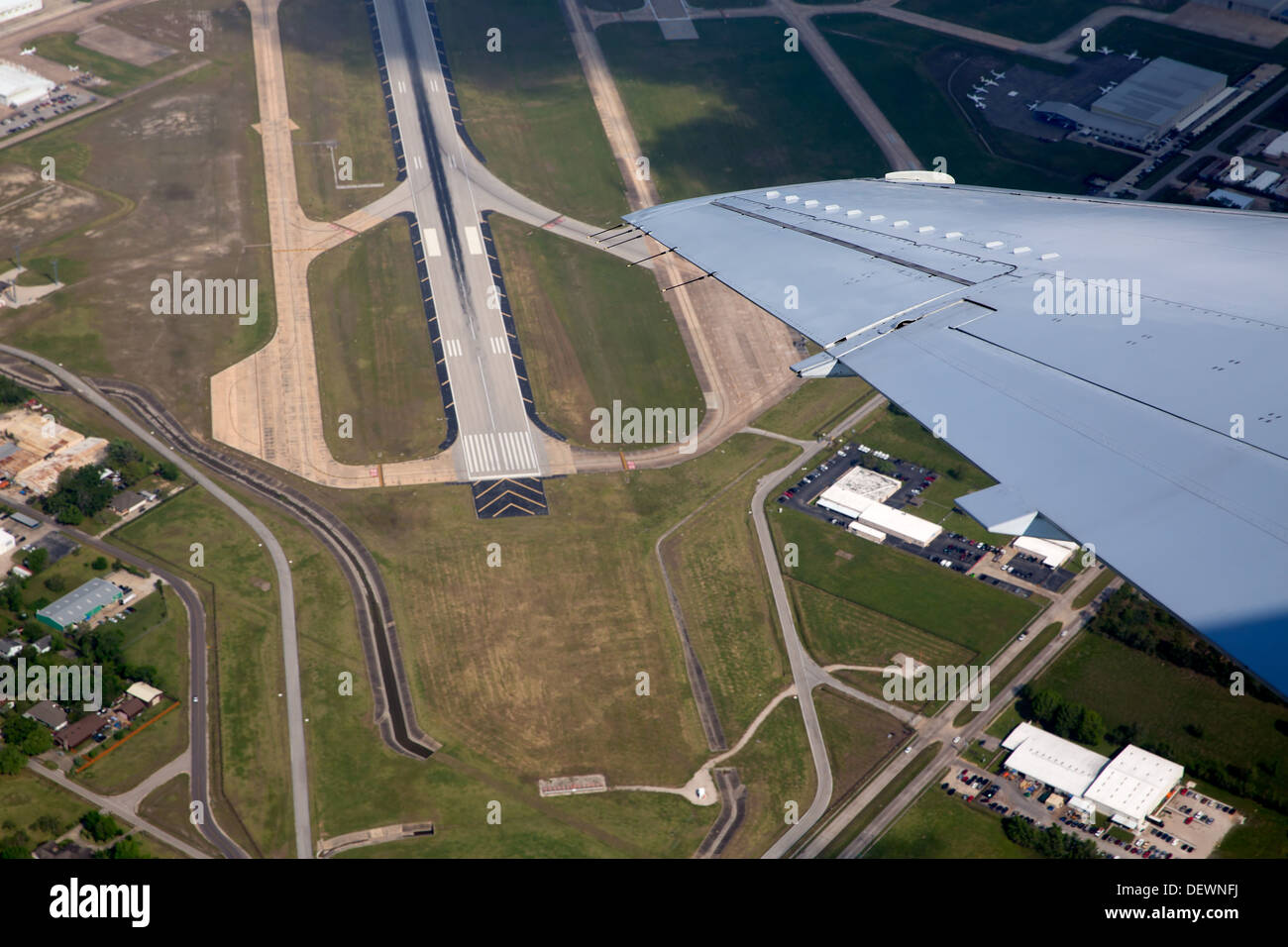Airport landing road view from aerial view and aircraft wing Stock ...