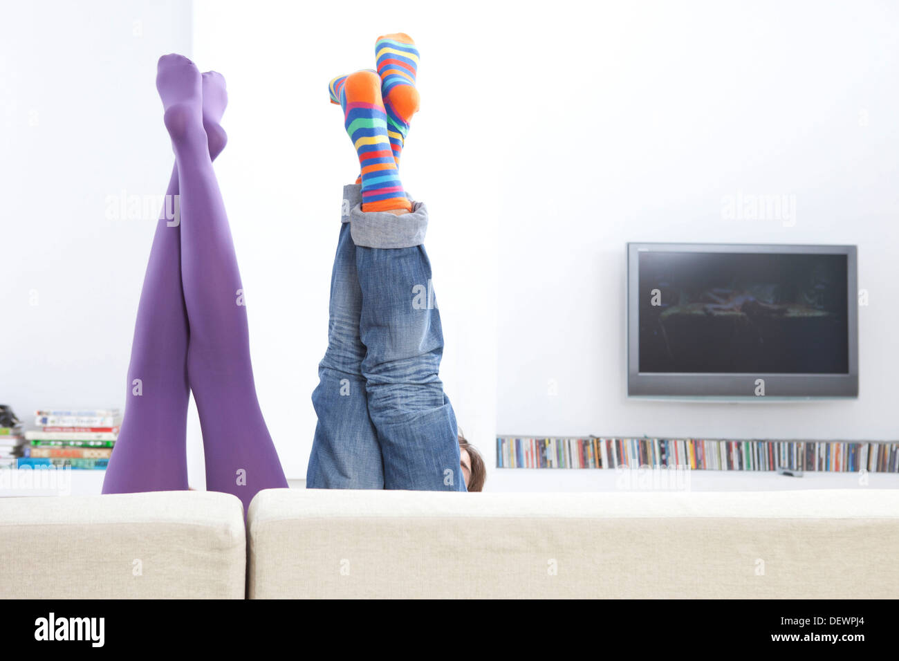 Legs over sofa hi-res stock photography and images - Alamy