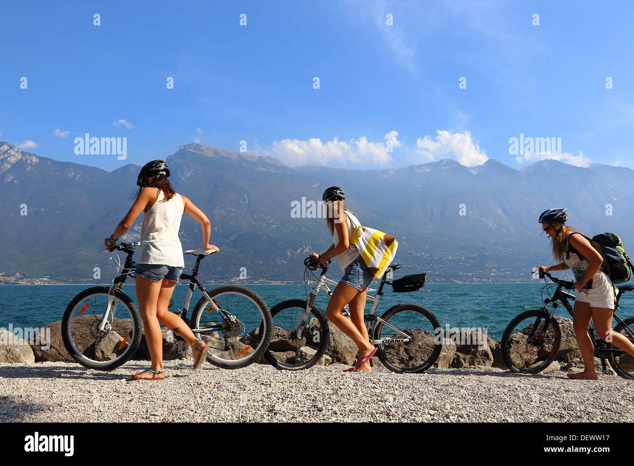 Women with bikes by the Lake Garda, Italy Stock Photo - Alamy