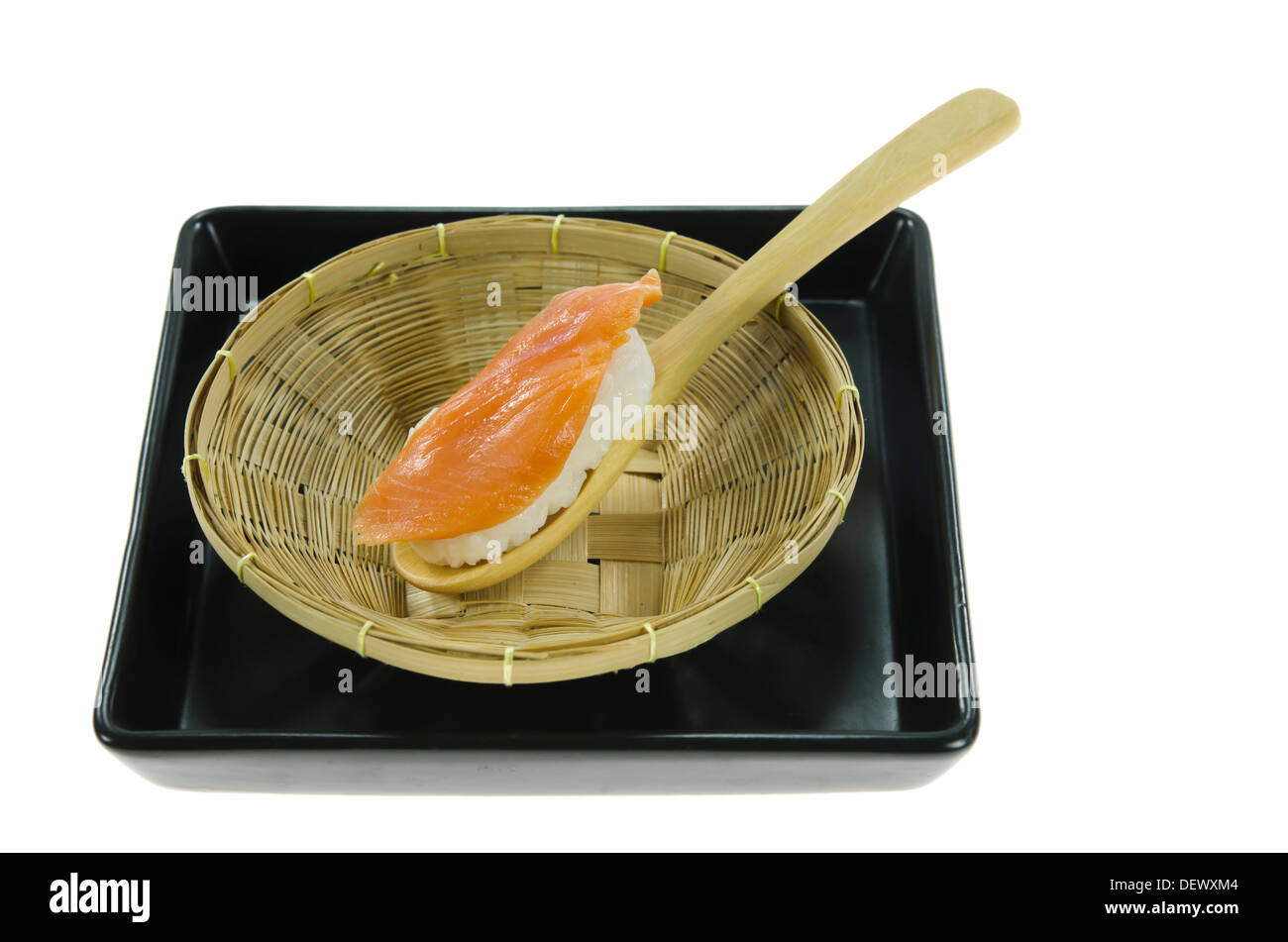 salmon sushi with wooden spoon in black plate on white background Stock ...
