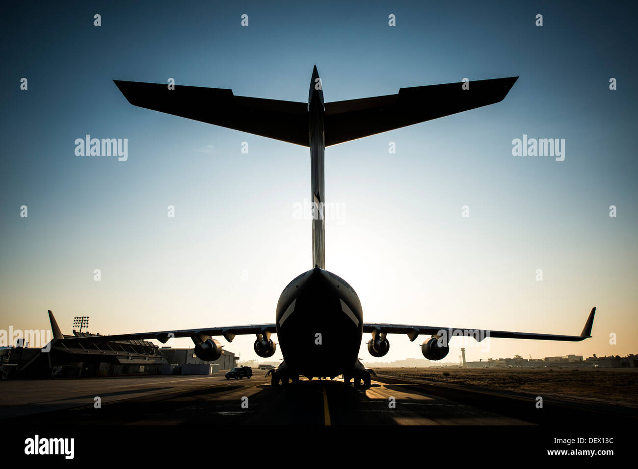 The sun rises above the final U.S. Air Force C-17 Globemaster III, P ...