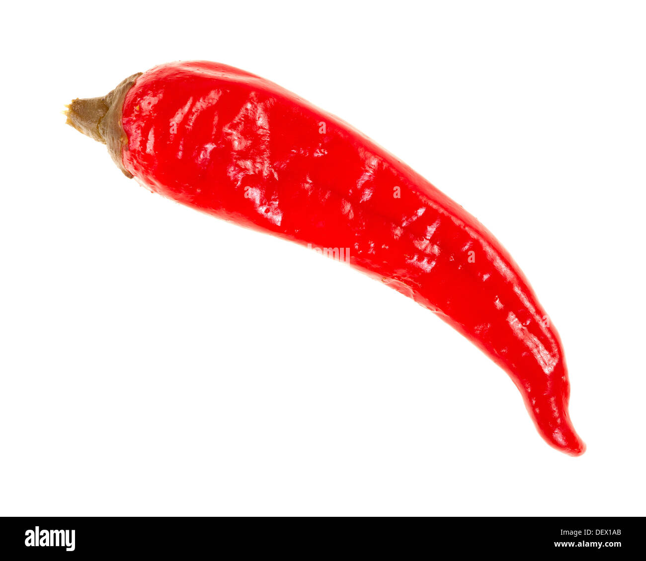 A single red pickled pepper on a white background Stock Photo - Alamy