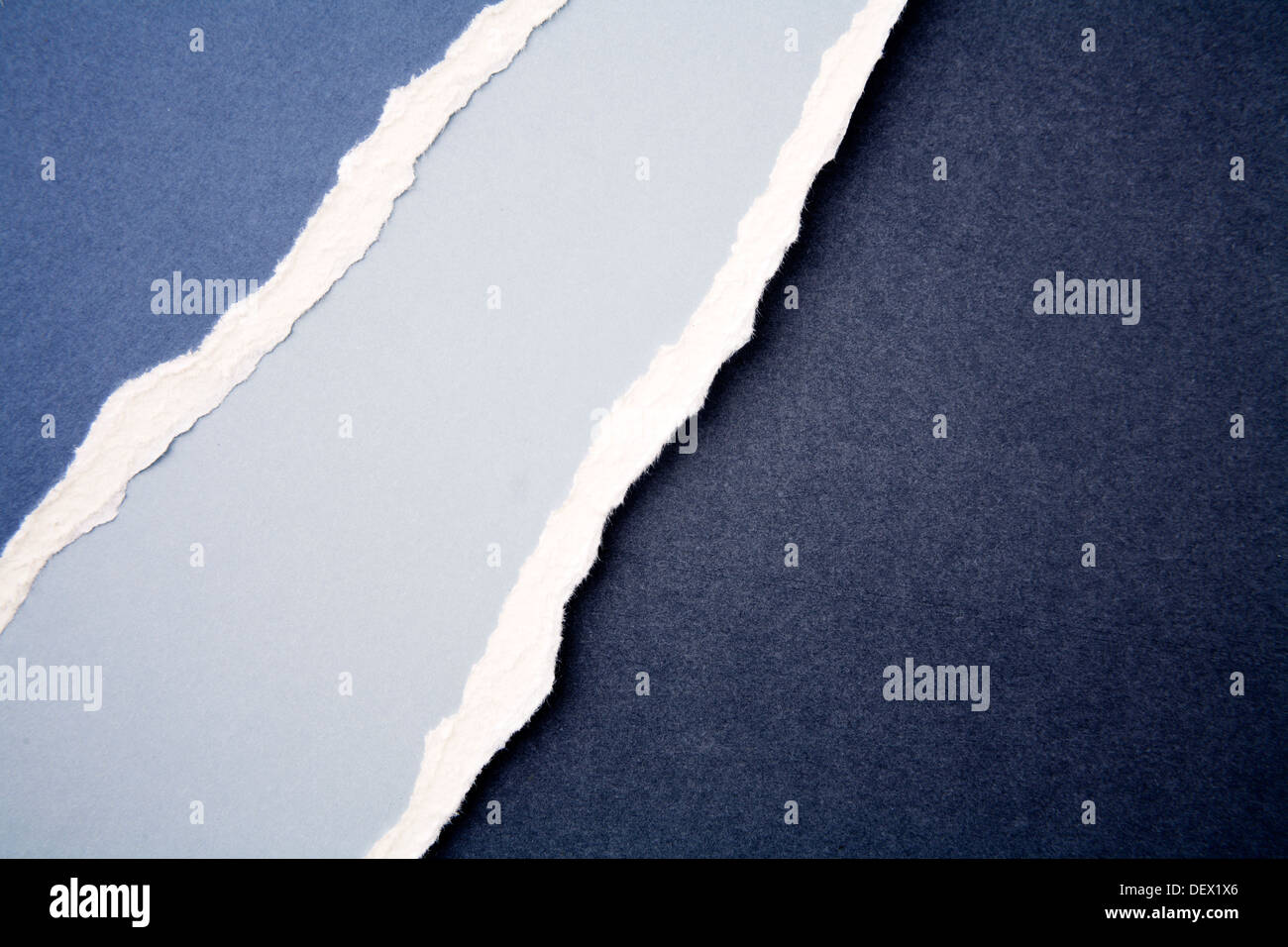 Closeup of ripped blue paper Stock Photo - Alamy