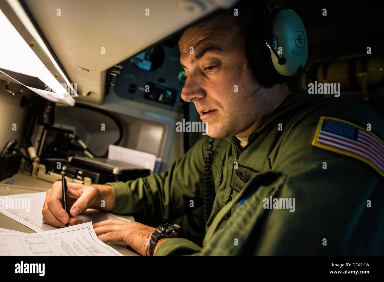 Tech. Sgt. Mike Morris, 437th Airlift Wing loadmaster, fills out flight ...