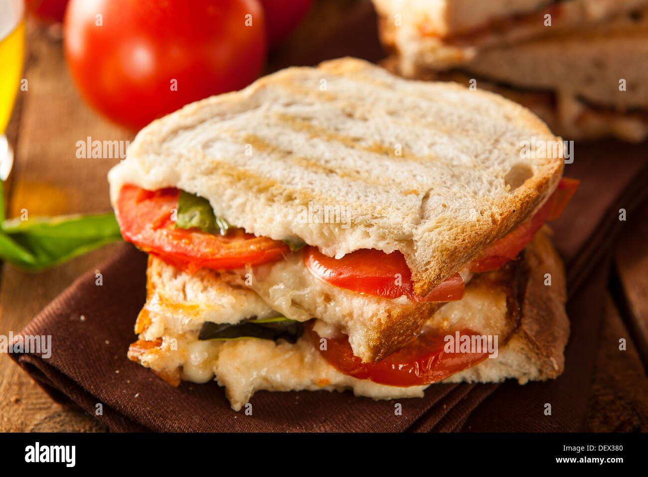 Homemade Tomato and Mozzarella Panini with Basil Stock Photo - Alamy