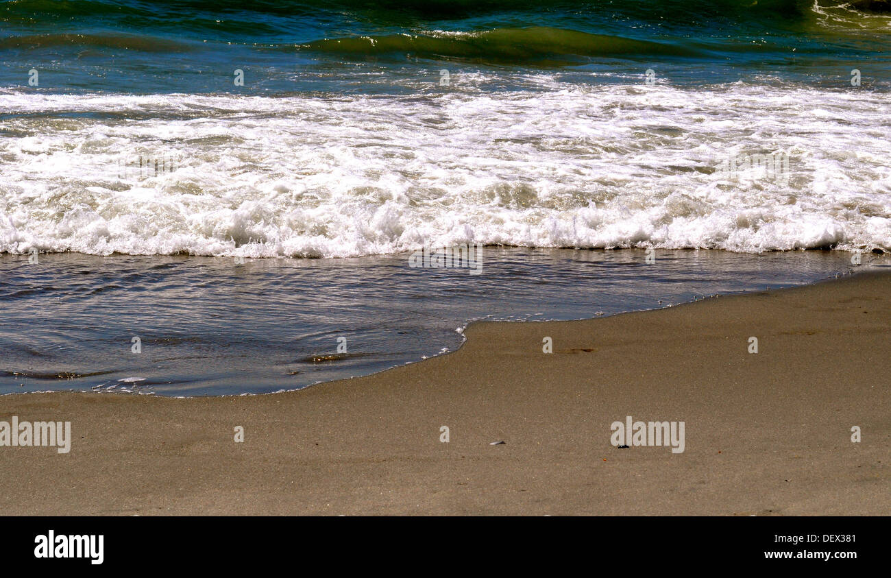 Sand and Waves Stock Photo - Alamy