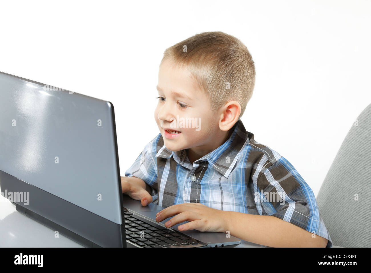 Computer addiction child boy with laptop notebook white background ...