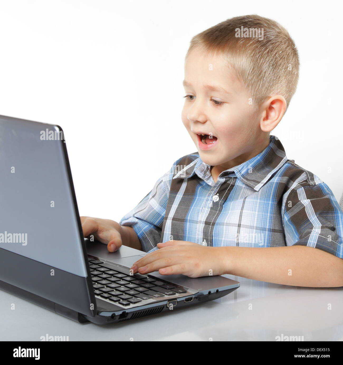 Computer addiction child boy with laptop notebook white background ...