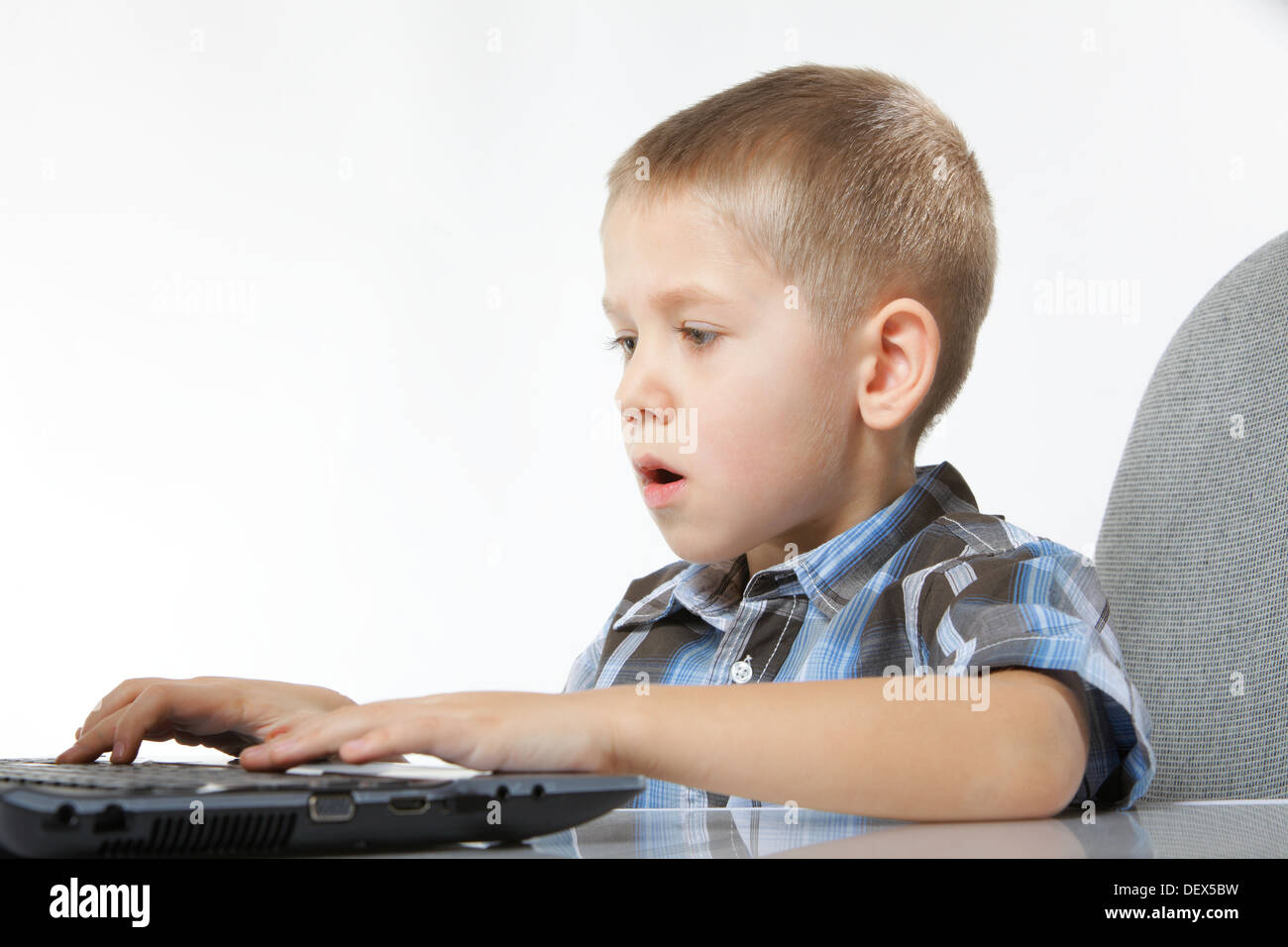 Computer addiction child boy with laptop notebook white background ...