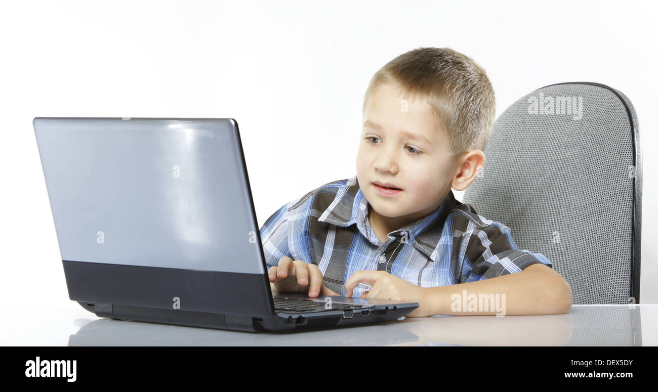 Computer addiction child boy with laptop notebook white background ...