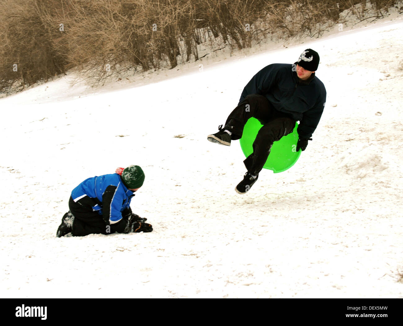 sledding - mid air crash Stock Photo - Alamy