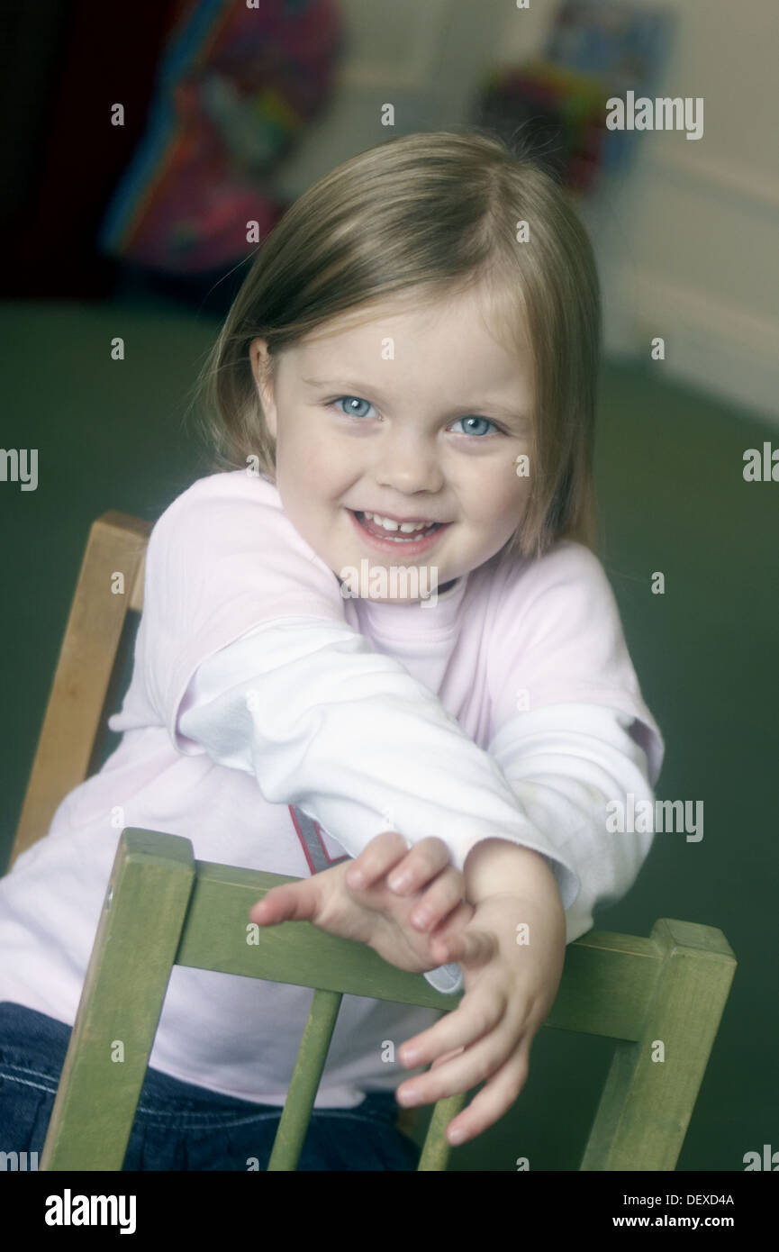 3 year old girl playing nursery smiling hi-res stock photography and ...