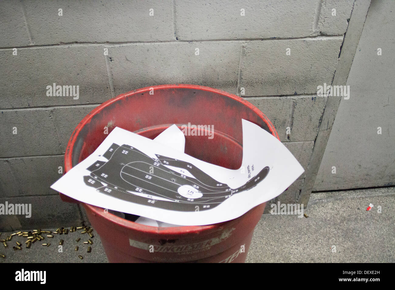 A used target sits in the garbage of an indoor shooting range on Apr. 5 ...