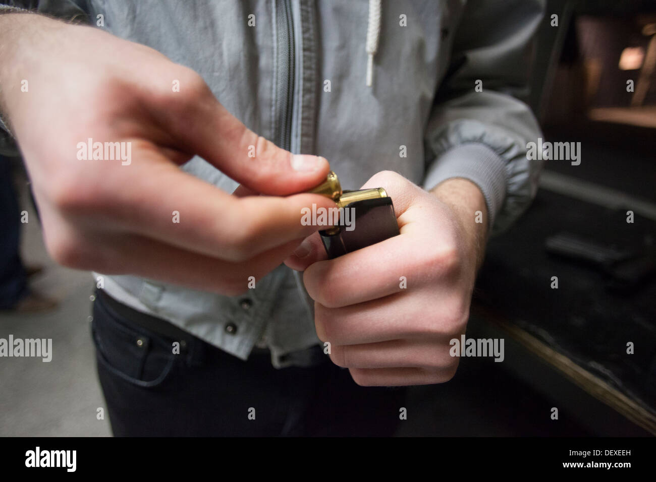 Reloading bullets into a clip at an indoor shooting range on Apr. 5 ...