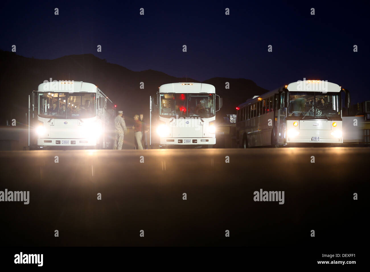 Buses loaded with Marines and sailors with Bravo Company, 1st Battalion ...