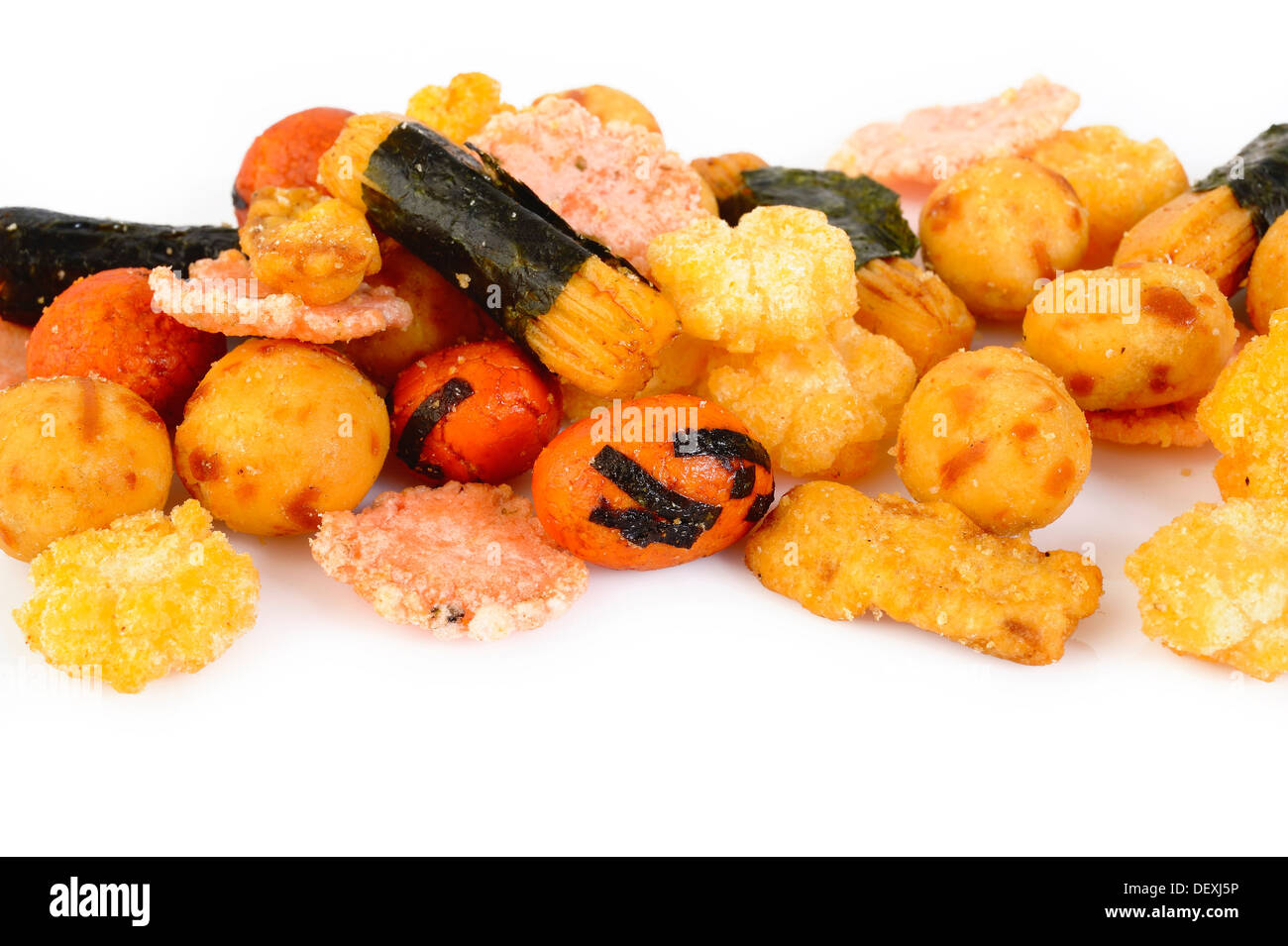 snack balls filled with peanuts and rice crackers on white background ...