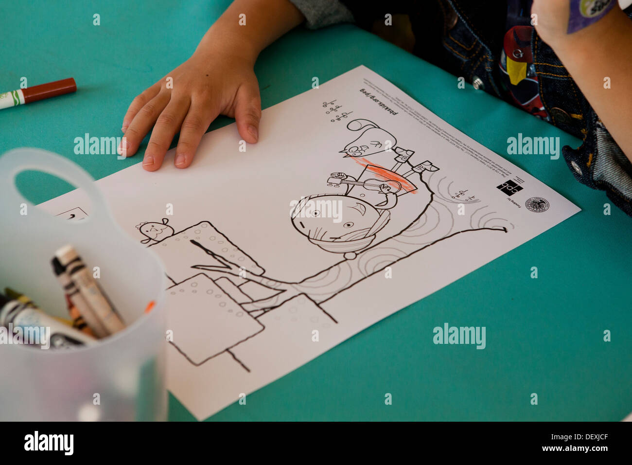 Child coloring on paper Stock Photo - Alamy