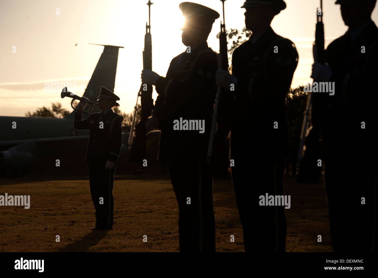 Altus AFB Honor Guard members perform a twenty-one gun salute and a ...