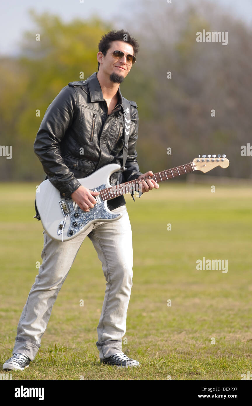 young rock musician playing electric guitar outdoor Stock Photo - Alamy