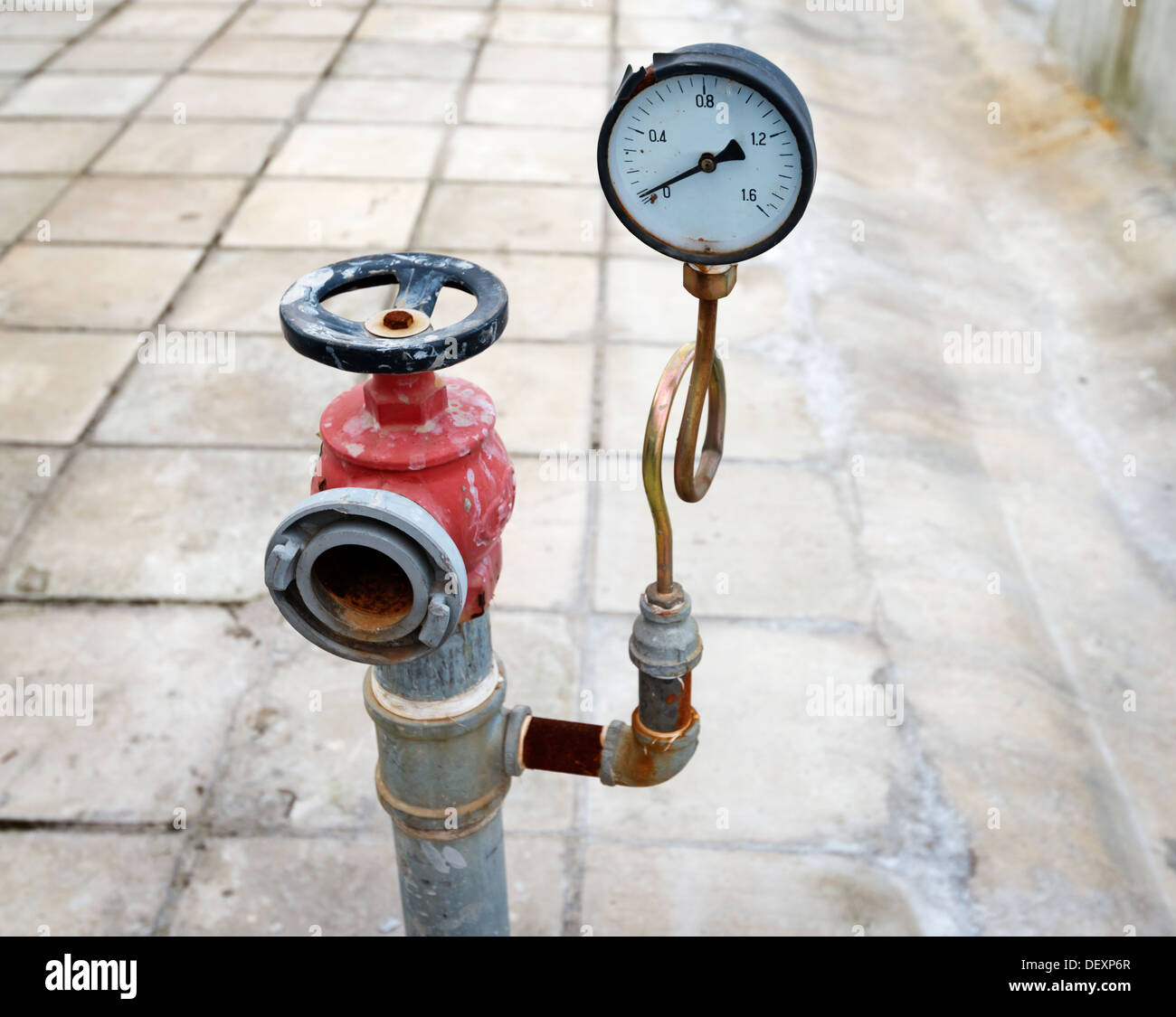 Closeup of manometer, pipes and faucet valves of heating system in a ...