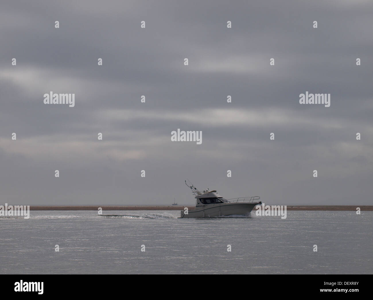 Rodman motorboat heading along the estuary to Exmouth, Devon, UK 2013 ...