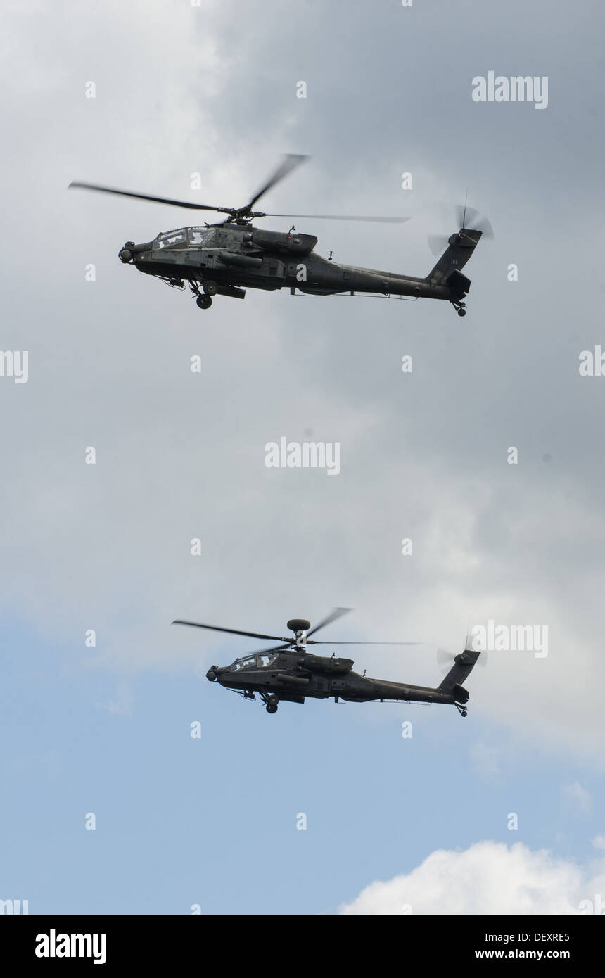 AH-64 Apache helicopters hover over the firing line during the combined ...