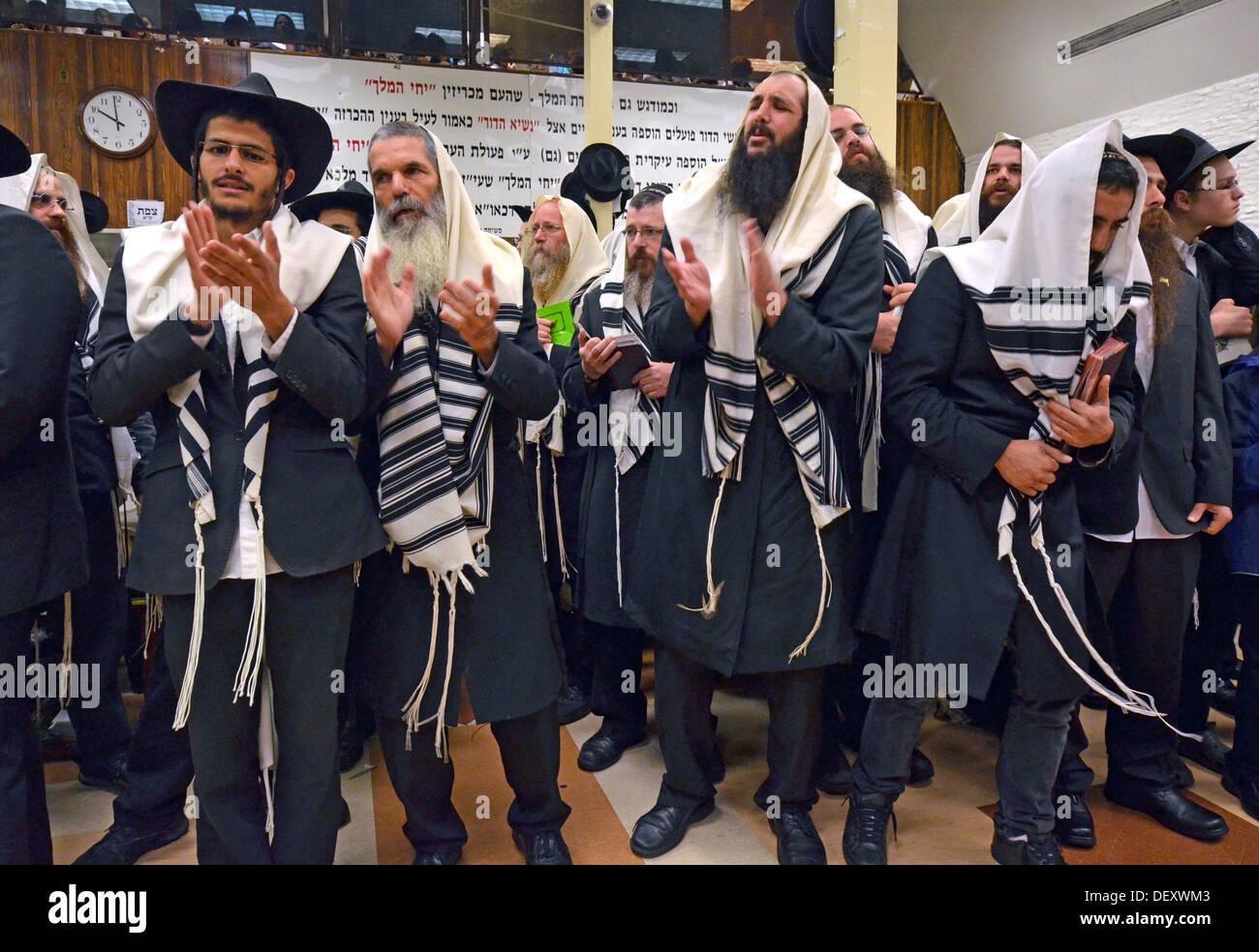 Religious Jewish men in prayer at Sukkot morning services in Crown ...