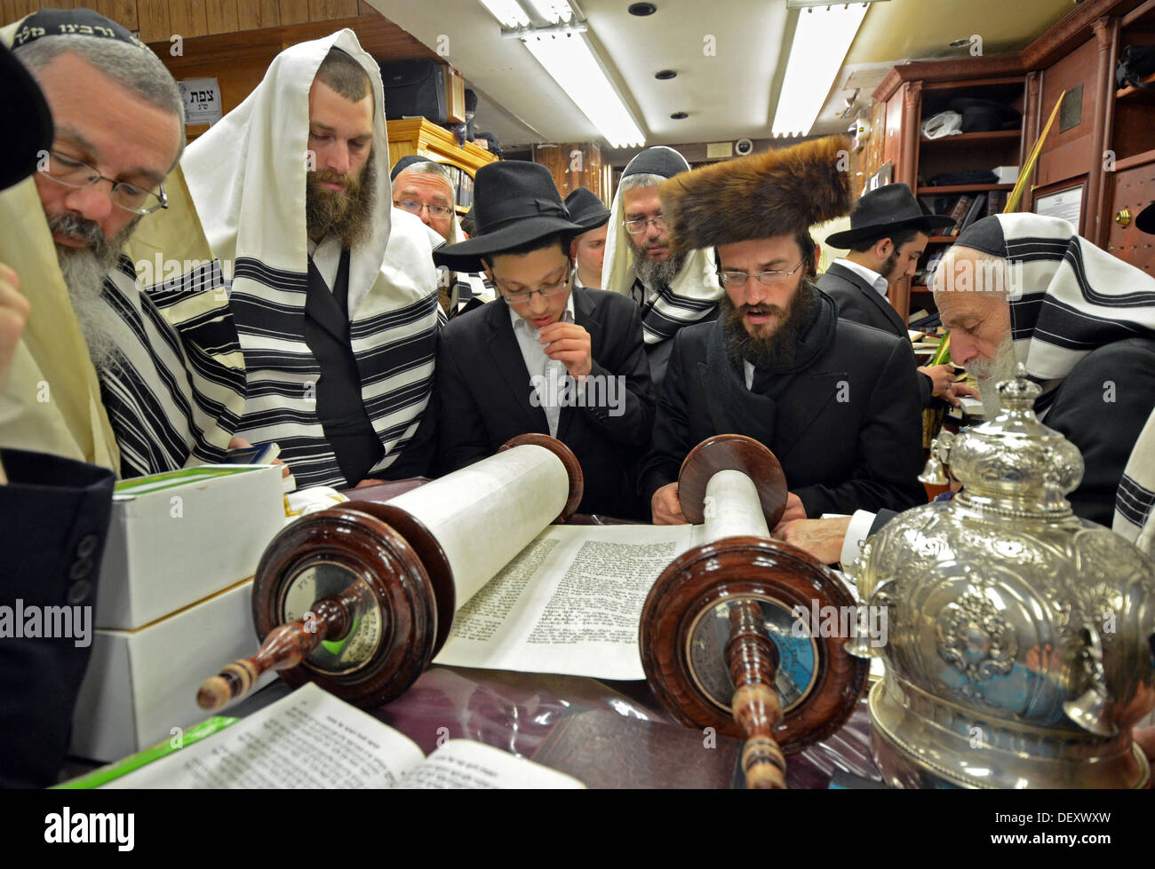 Torah reading by religious Jewish worshipers at morning services in a ...