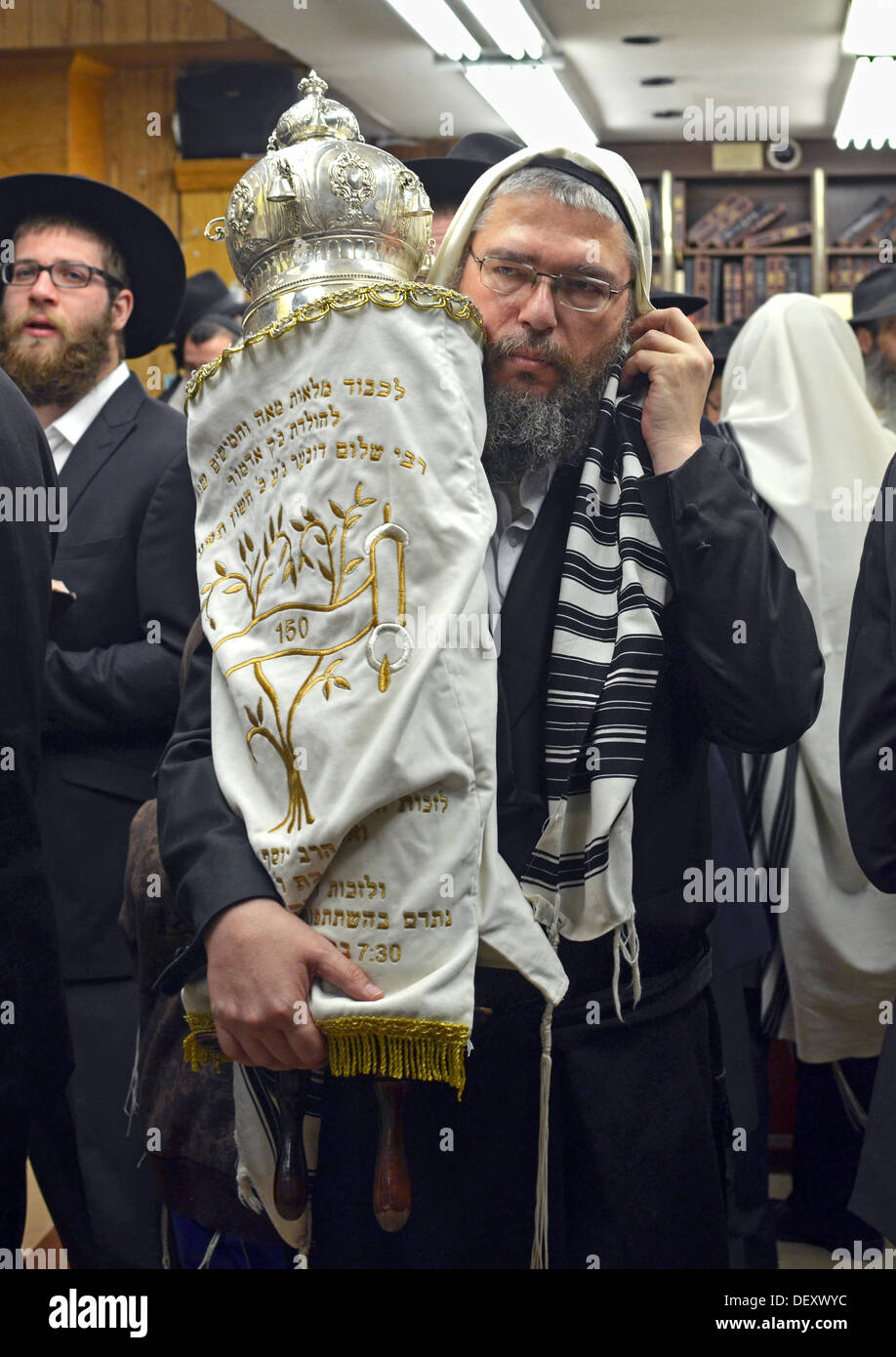 The Torah is returned to it Holy Ark by religious Jewish worshipers at ...