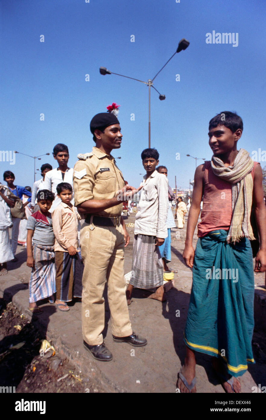 Policeman talking to man hi-res stock photography and images - Alamy