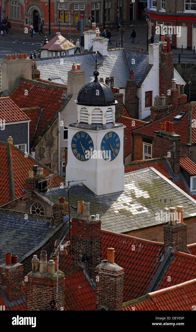 The white steeple of the tower of the Market Hall between the roofs of ...