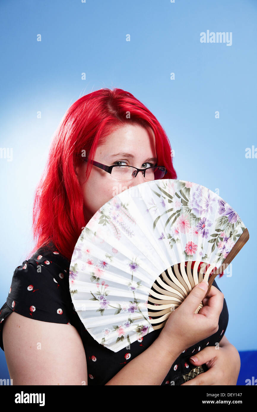 Lady with red fan hi-res stock photography and images - Alamy