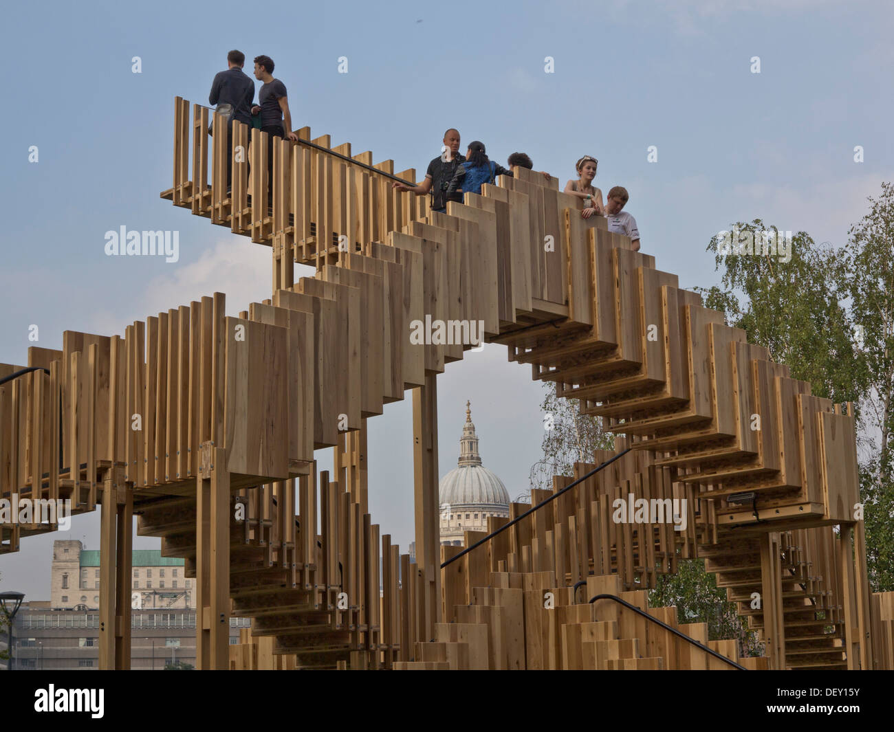 Visitors to the Endless Stair wooden installation made of cross ...