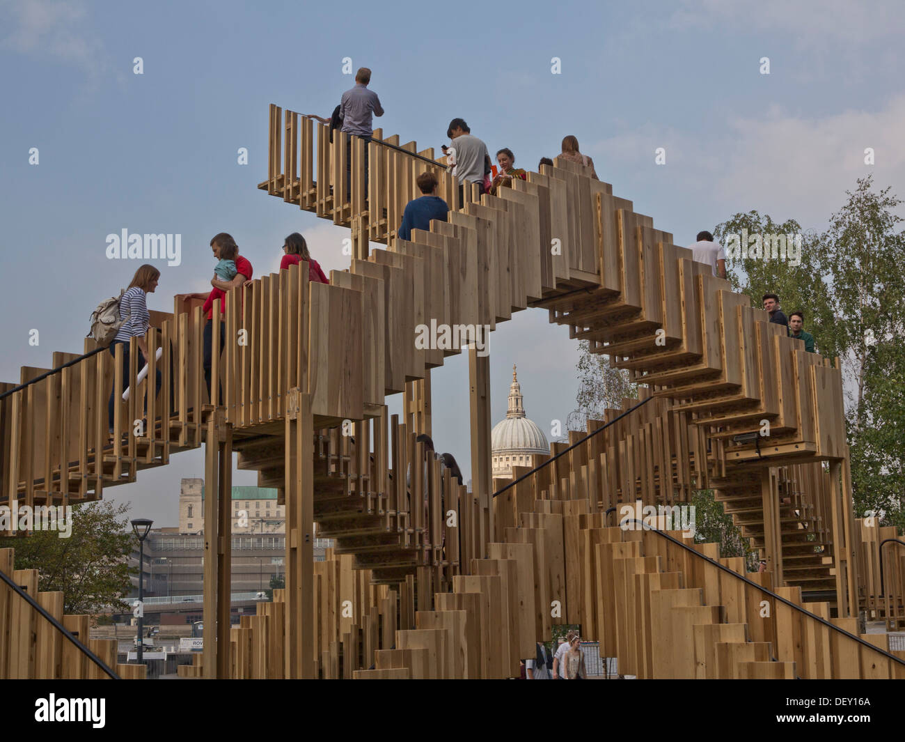 Visitors to the Endless Stair wooden installation made of cross ...