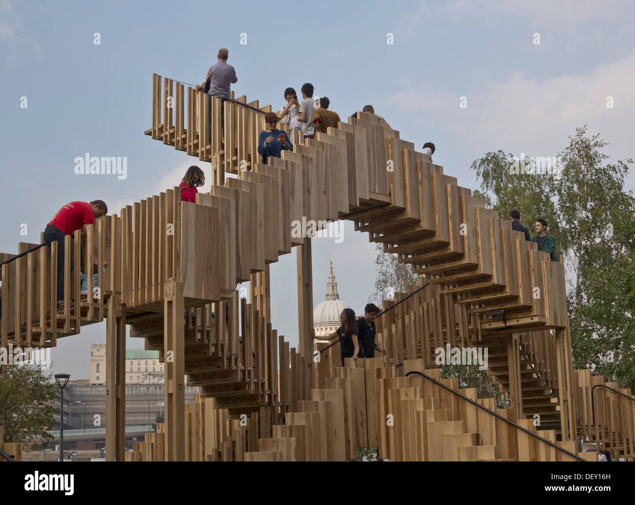 Visitors to the Endless Stair wooden installation made of cross ...