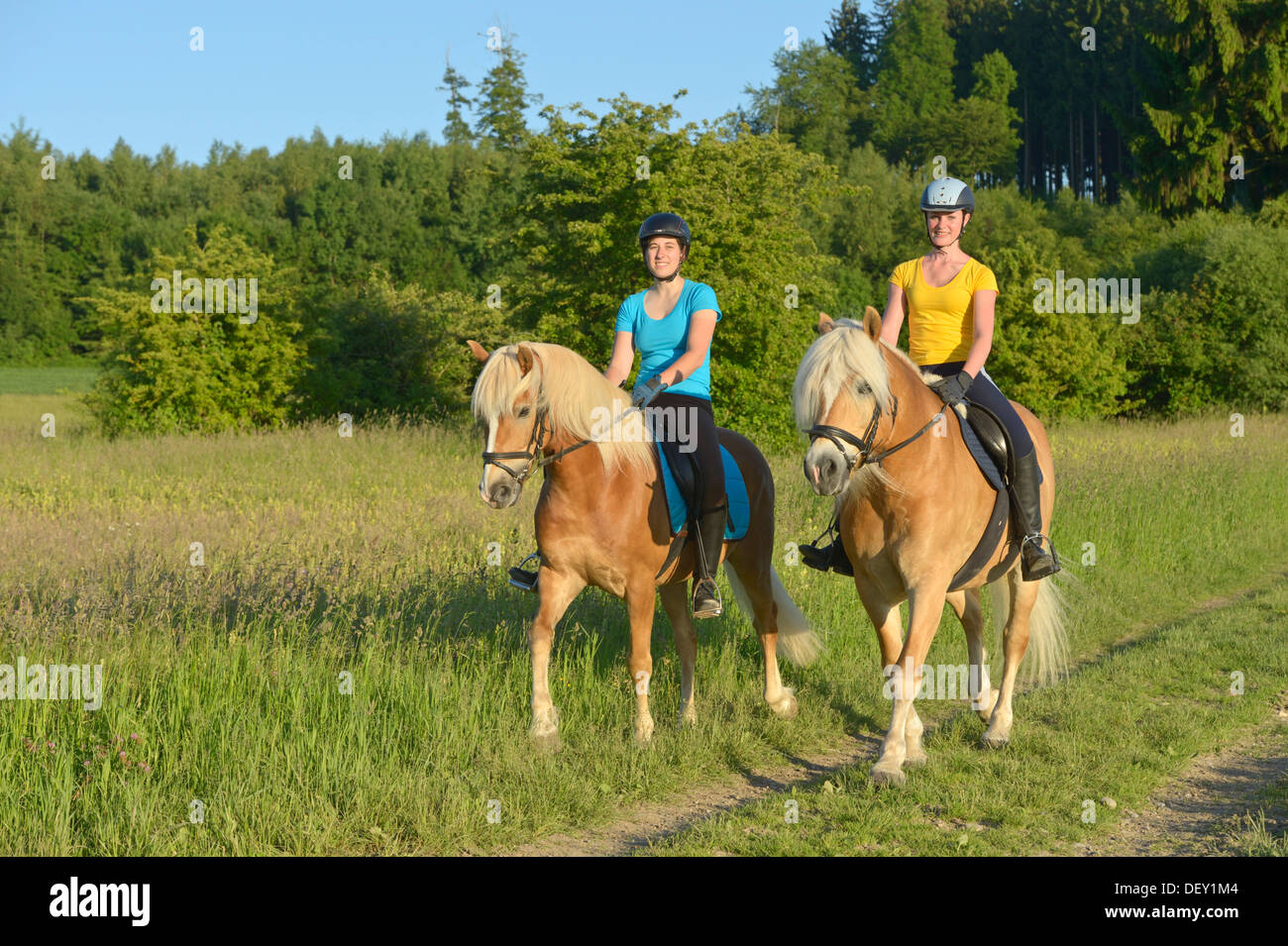 Two women walk out hi-res stock photography and images - Alamy