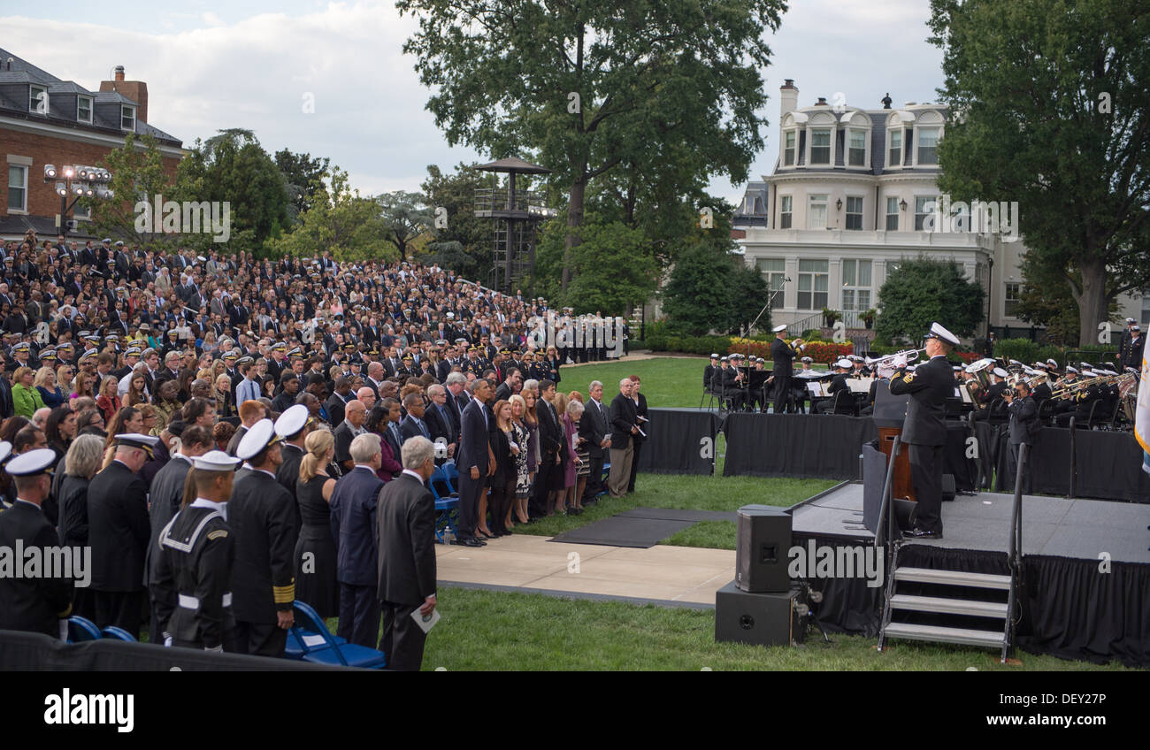A sailor plays Taps during a memorial for those killed during a ...