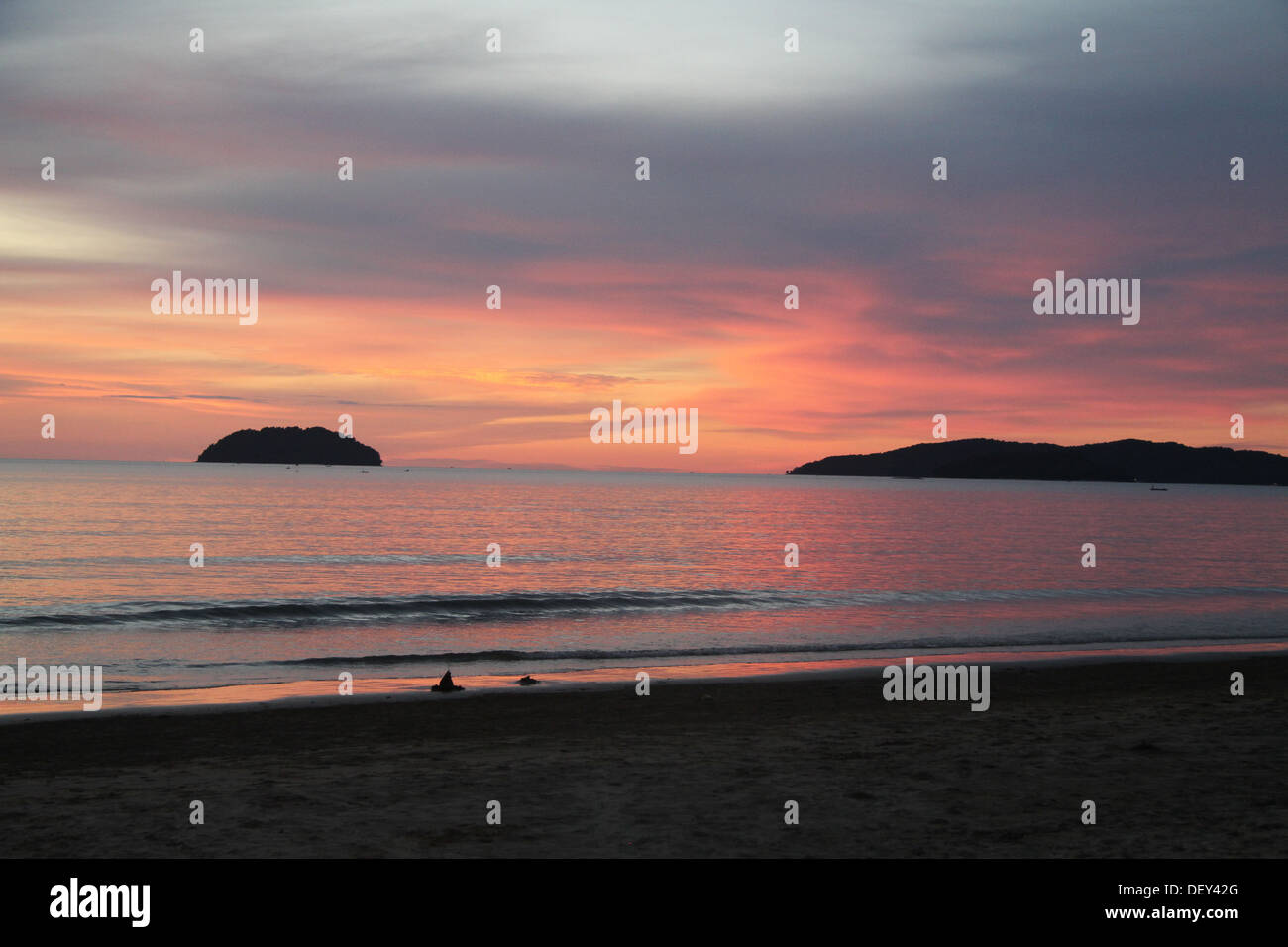 Sunset on Beach with islands Stock Photo - Alamy