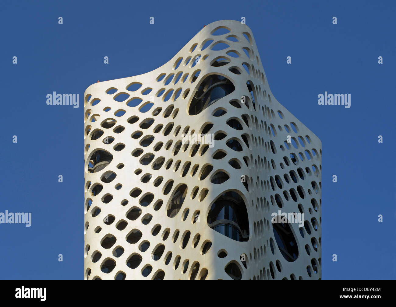 O-14 Tower, nicknamed Cheese Tower, against a blue sky, Business Bay ...