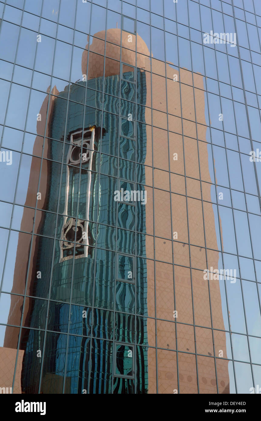 Skyscraper reflected in the glass window front of another skyscraper ...