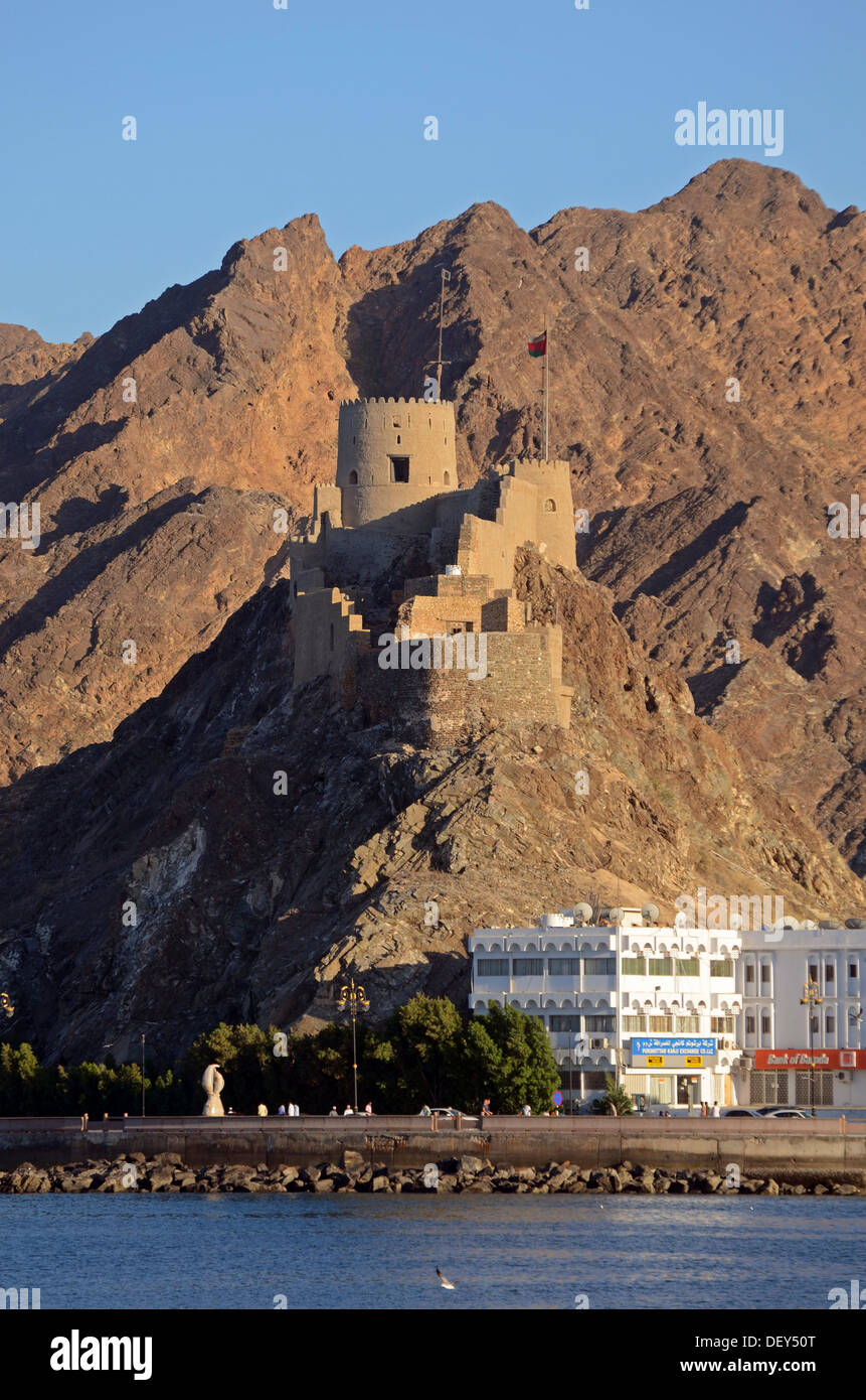 The corniche of Muttrah and the rocky mountains that surround the city ...