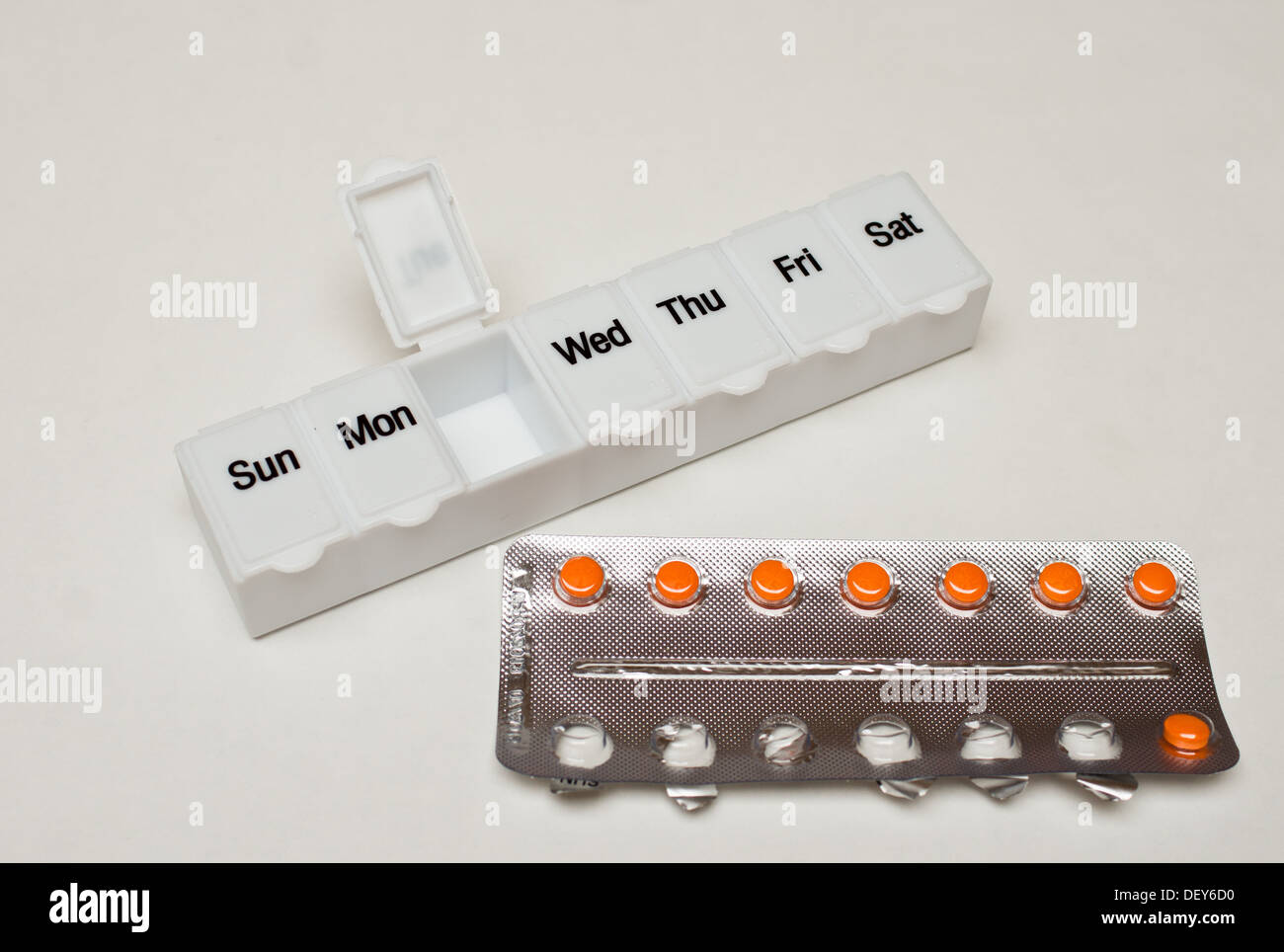 A seven day pill reminder on a white background Stock Photo - Alamy
